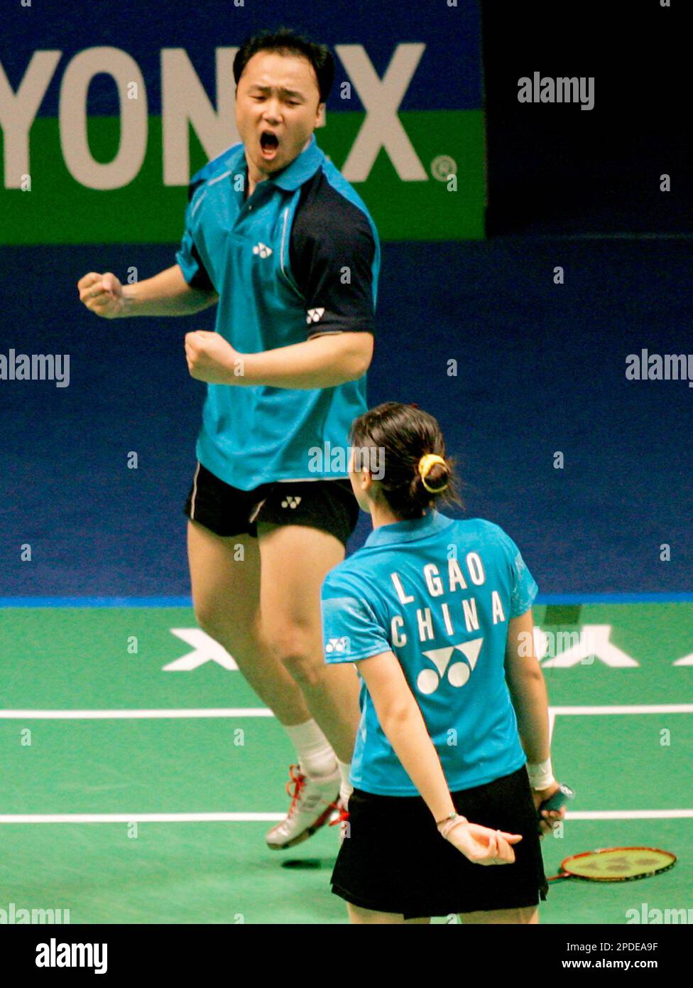 China's Gao Ling, right, and Zhang Jun celebrate after beating England ...