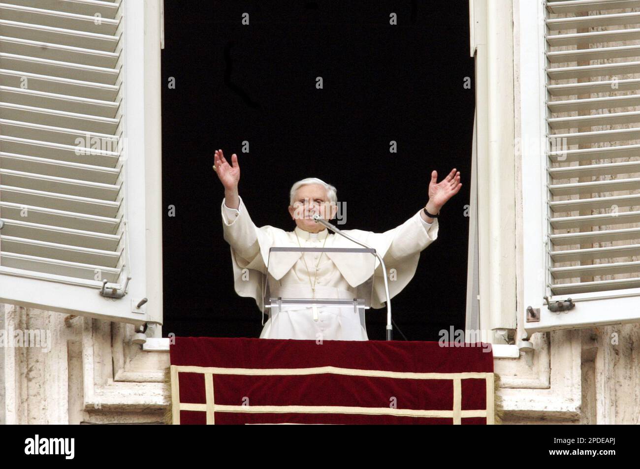 Pope Benedict XVI delivers his blessing for the window of his studio ...