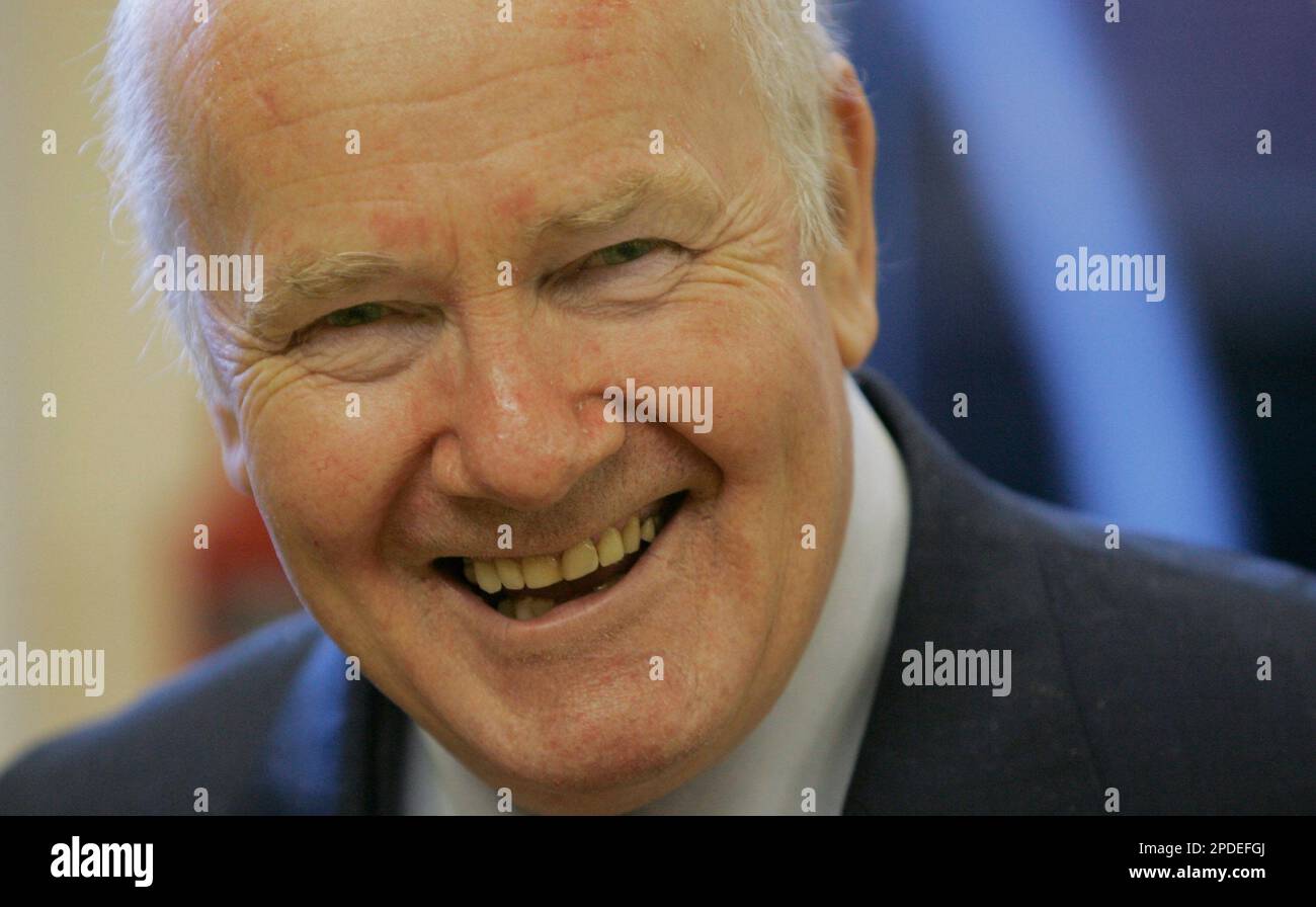 Britain's Defence Secretary Dr John Reid smiles as he watches injured ...