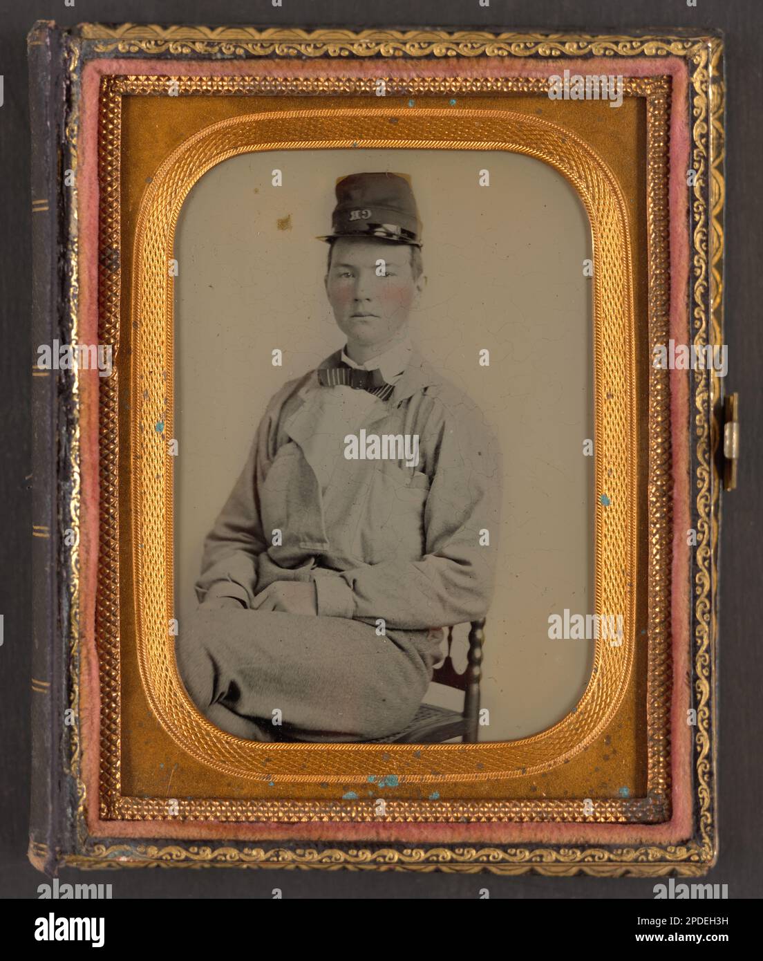Unidentified soldier in Confederate uniform and hat with initials C.R ...