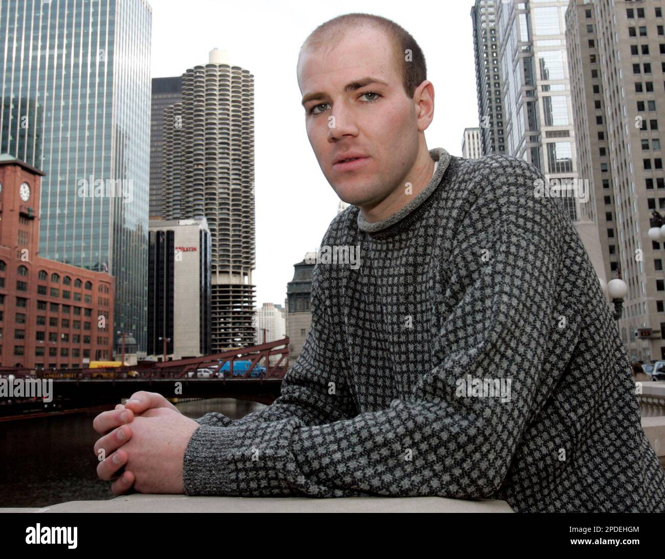 Chicago Bulls fan Michael Axelrod stands along the Chicago River ...