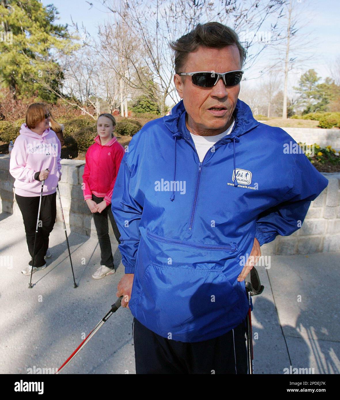 Markku Mustonen, right, prepares to skiwalk with fellow walkers Minna ...