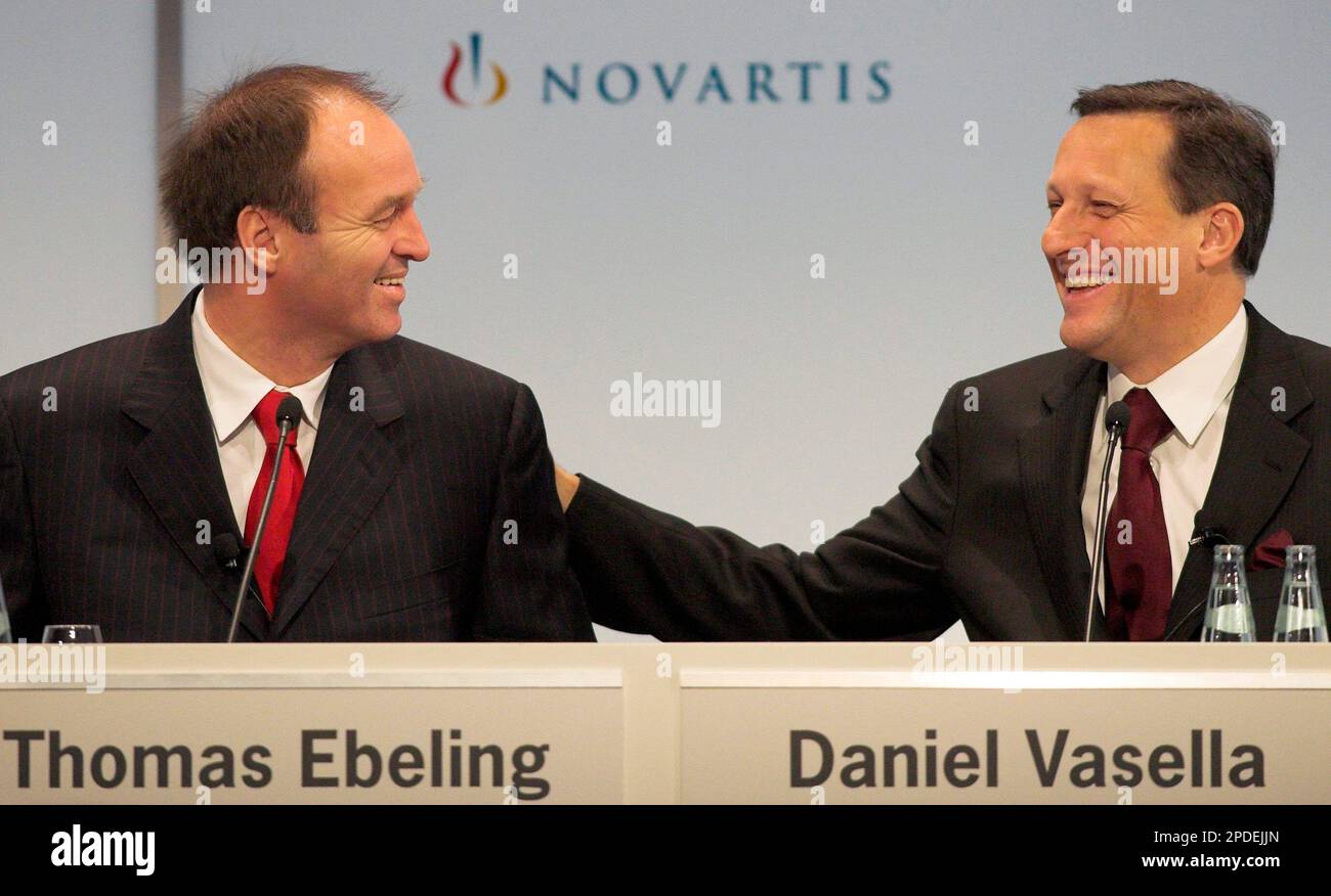 Thomas Ebeling, CEO Novartis Pharmaceuticals, left, and Daniel Vasella, CEO Novartis, smile ...