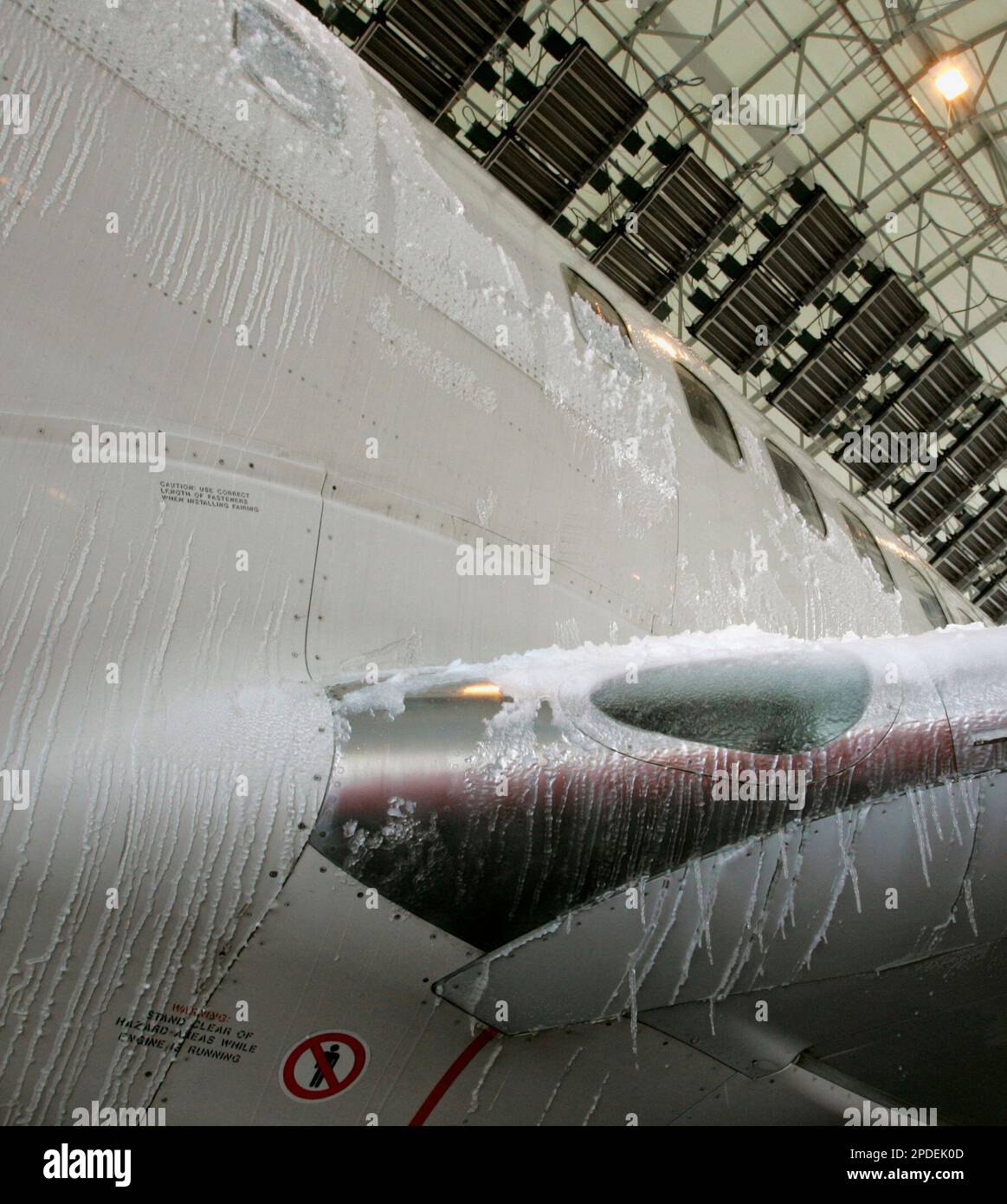A plane is de-iced as the first infrared de-icing hangar for large ...