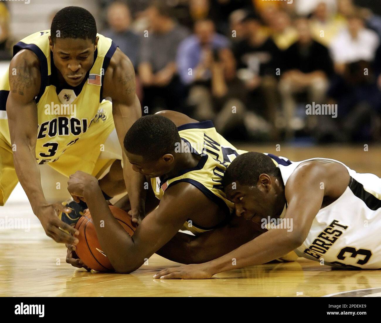 Georgia Tech players Anthony Morrow, center, and Lewis Clinch, left ...