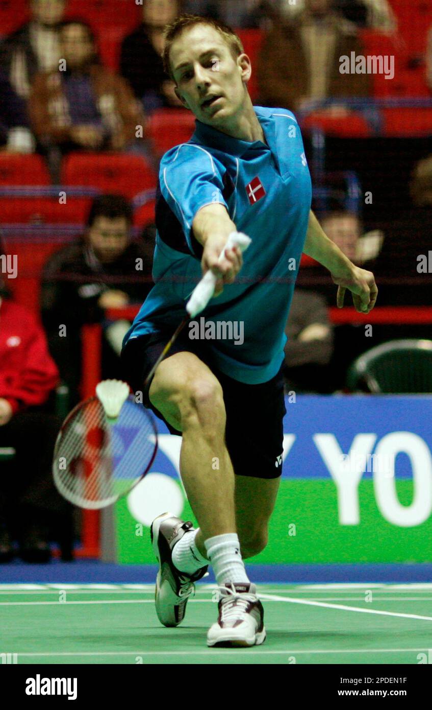 Fourth seed Denmark's Peter Gade hits a shot during his first round ...