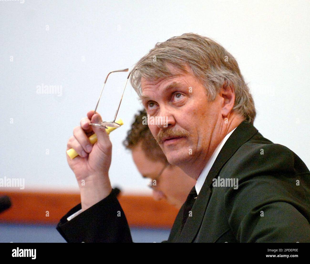 Cody Posey's court-appointed attorney Gary Mitchell listens to his ...