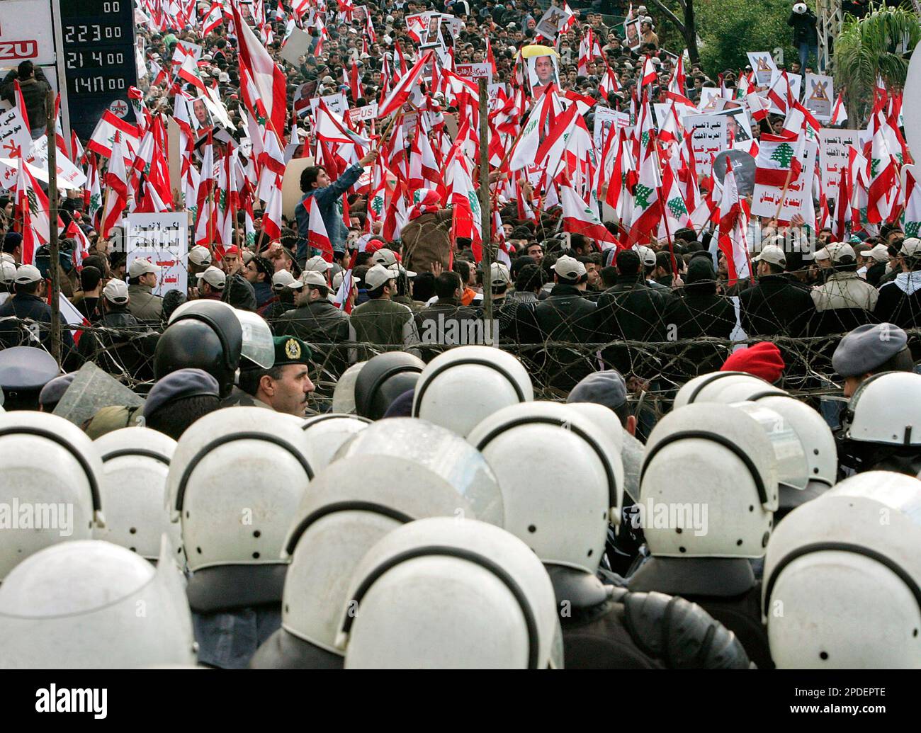 Pro-Syrian Lebanese demonstrators wave Lebanese flags as they protest ...