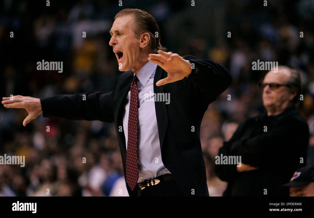 Miami Heat head coach Pat Riley, left, yells as actor Jack Nicholson ...