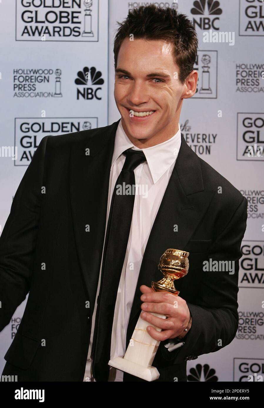 Irish actor Jonathan Rhys-Meyers poses with the award he won for best ...
