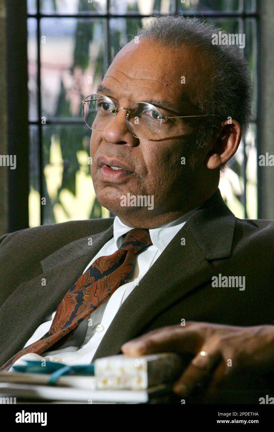 Middlesex Superior Court judge Julian Houston speaks with a reporter ...