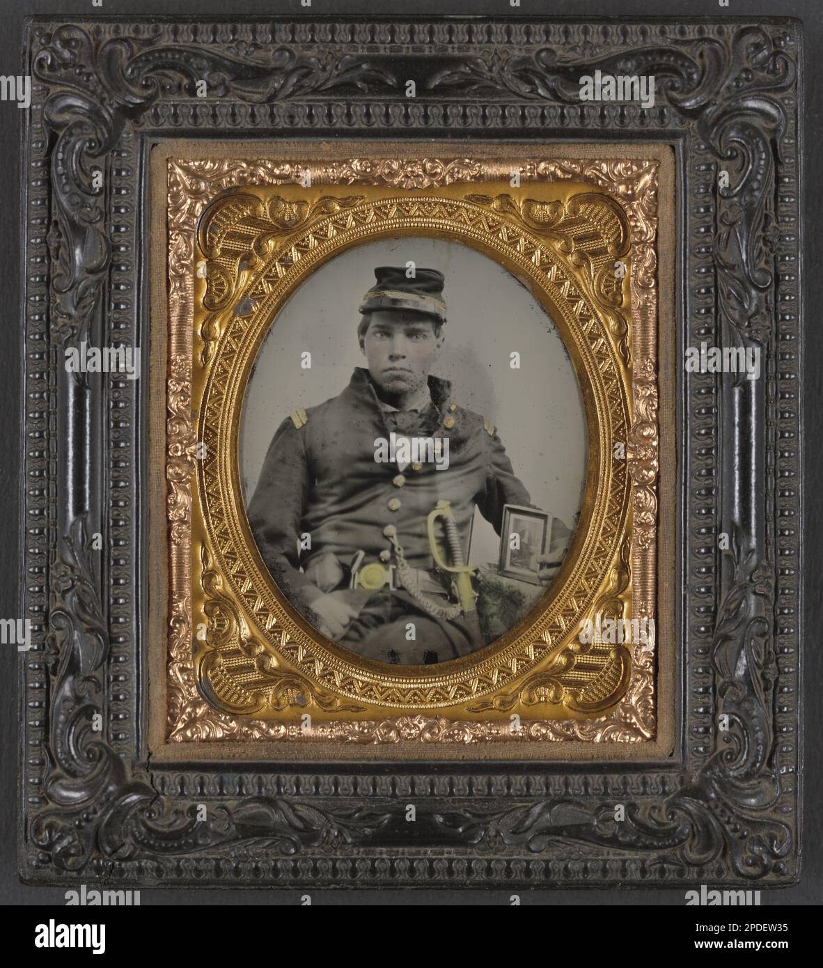 Unidentified soldier in Confederate officer's uniform with sword and ...