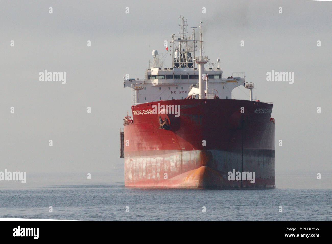 The huge bulk of the Arctic Char, a 48,000 ton oil tanker at anchor in ...
