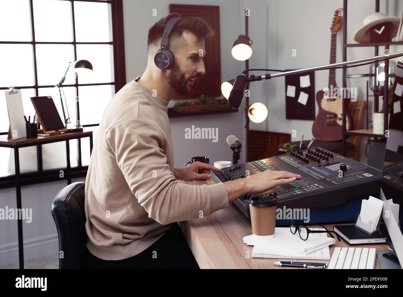 Man working as radio host in modern studio Stock Photo - Alamy