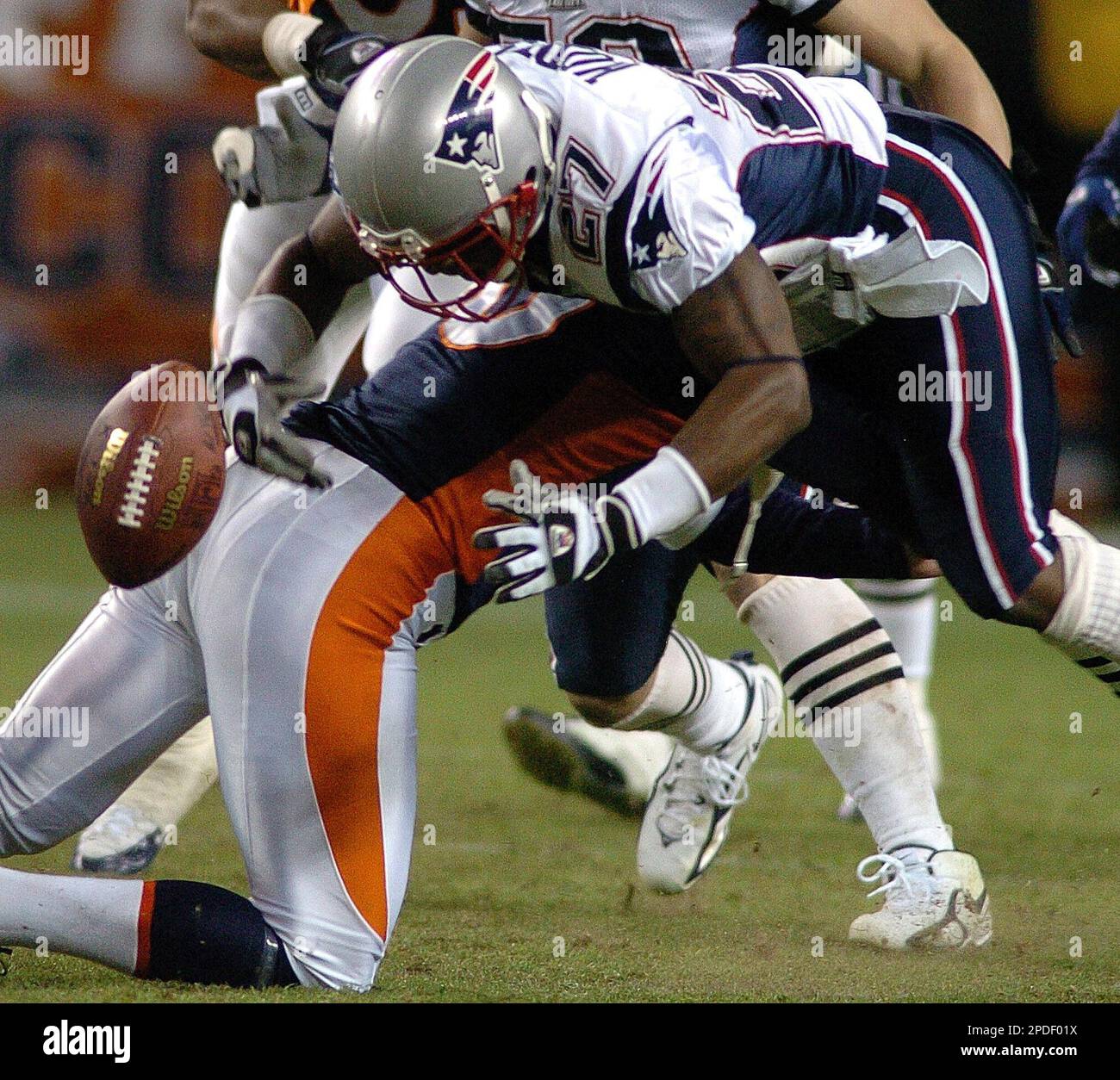 New England Patriots Ellis Hobbs (27) fumbles the football as he is hit ...