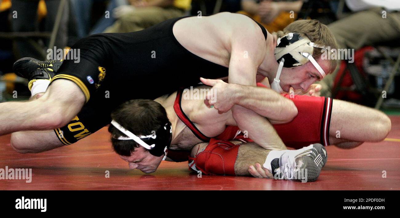 Iowa's Ty Eustice, top, defeats Nebraska's Ryan Davis in a 149-pound ...