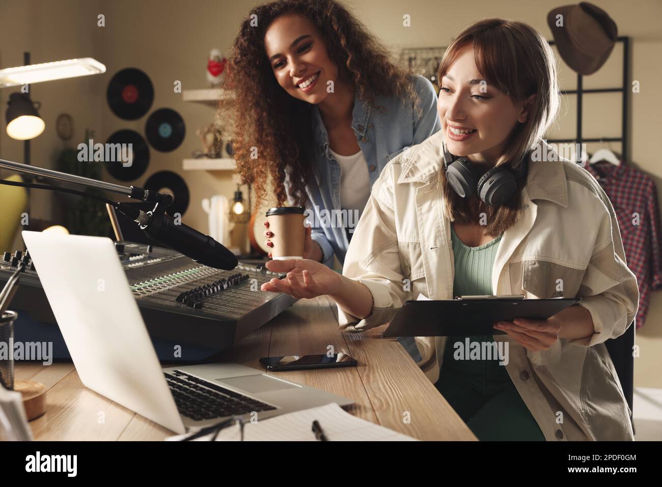 Young women working in modern radio studio Stock Photo - Alamy