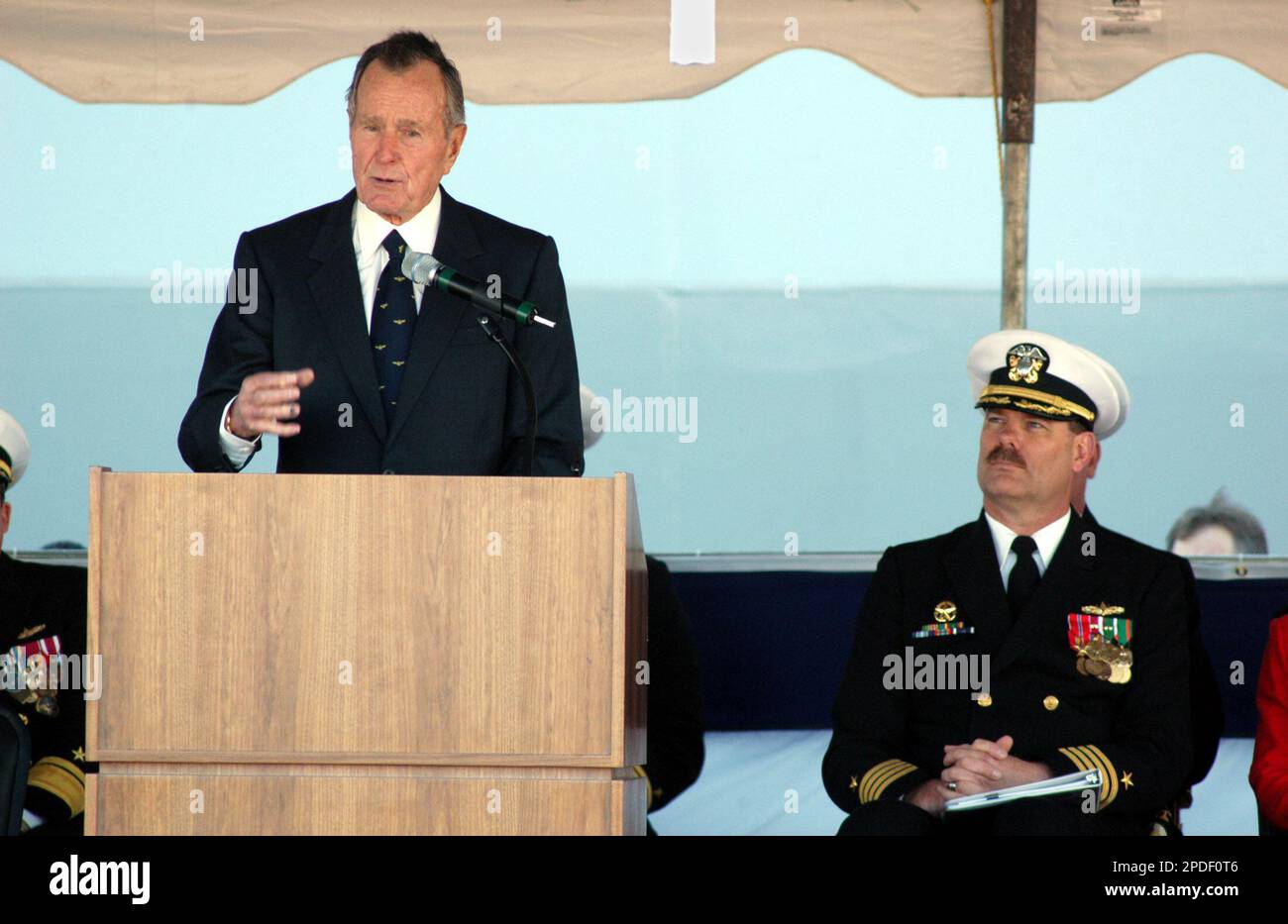 Capt. Jon Padfield, right, commander of the USS San Antonio, listens to ...