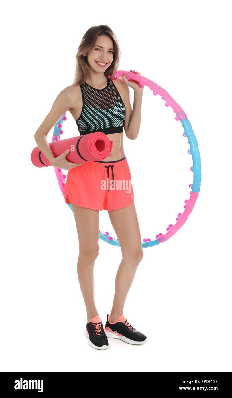 Beautiful woman with yoga mat and hula hoop on white background Stock ...