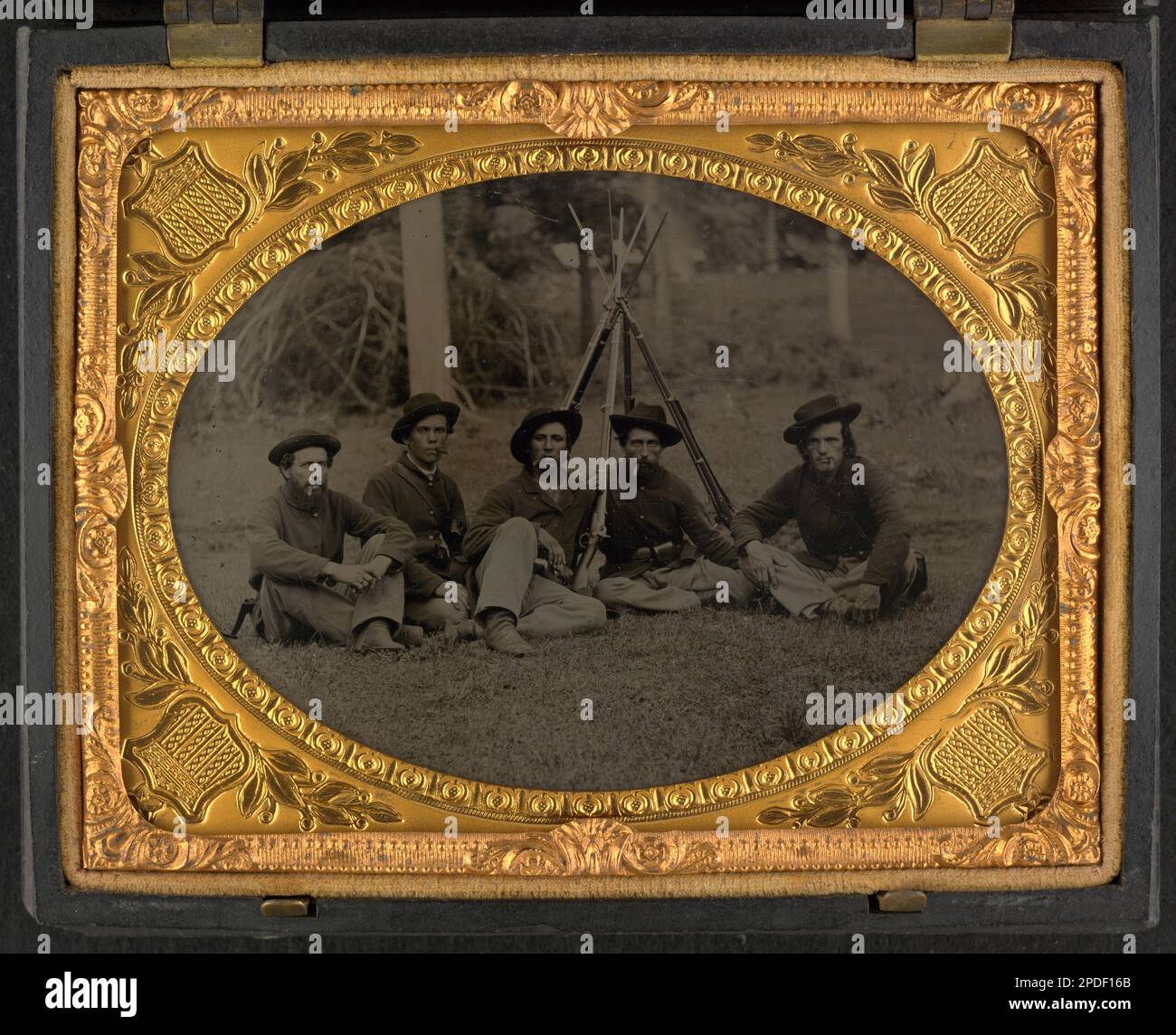 Five unidentified soldiers in Union uniforms seated with stacked ...