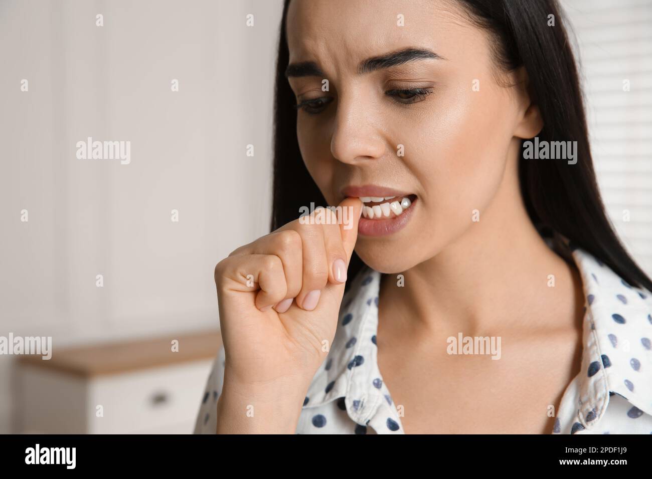 Woman nail biting anxious hi-res stock photography and images - Alamy