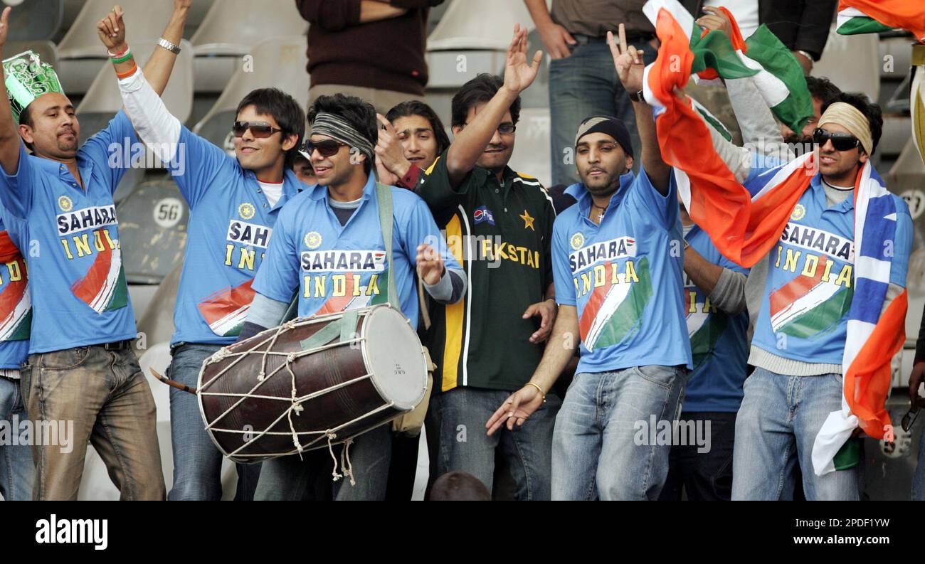 Cricket fans celebrate after India's Rahul Dravid scored a boundary ...