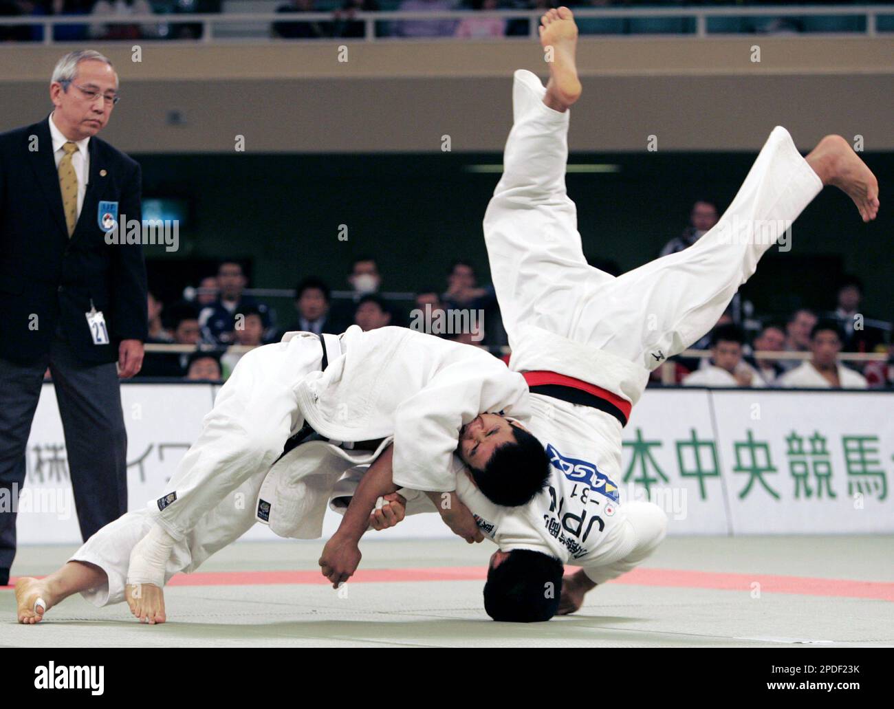 Song Dae-nam of South Korea, left, throws Hirotaka Kato of Japan during ...