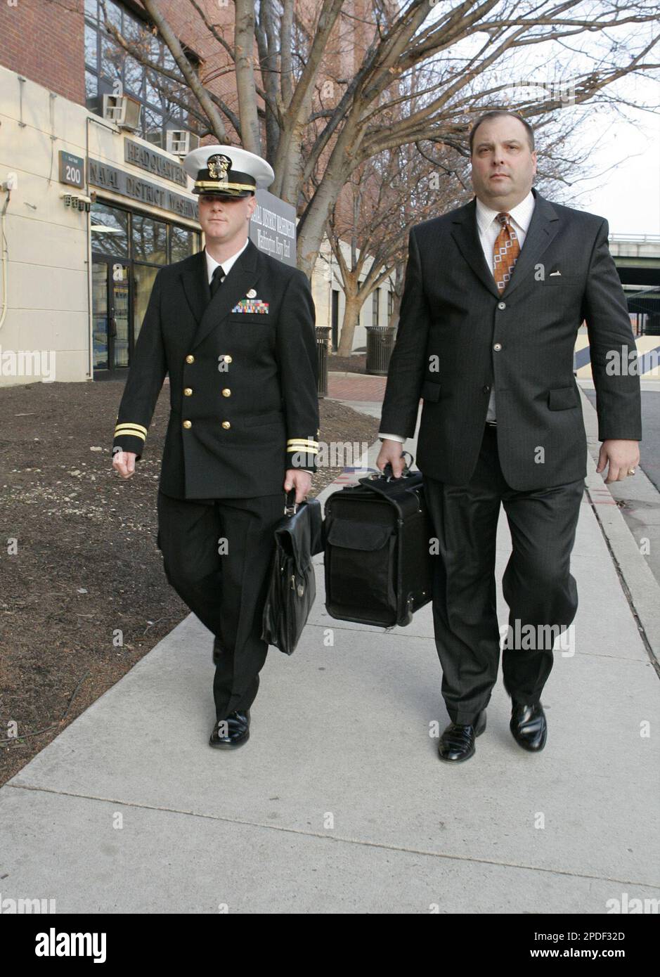 Lt. Bryan Black, left, an instructor at the U.S. Naval Academy in ...