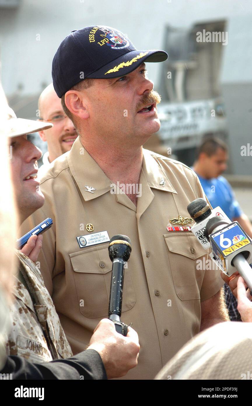 Captain Jon Padfield, commanding officer of the USS San Antonio, looks ...