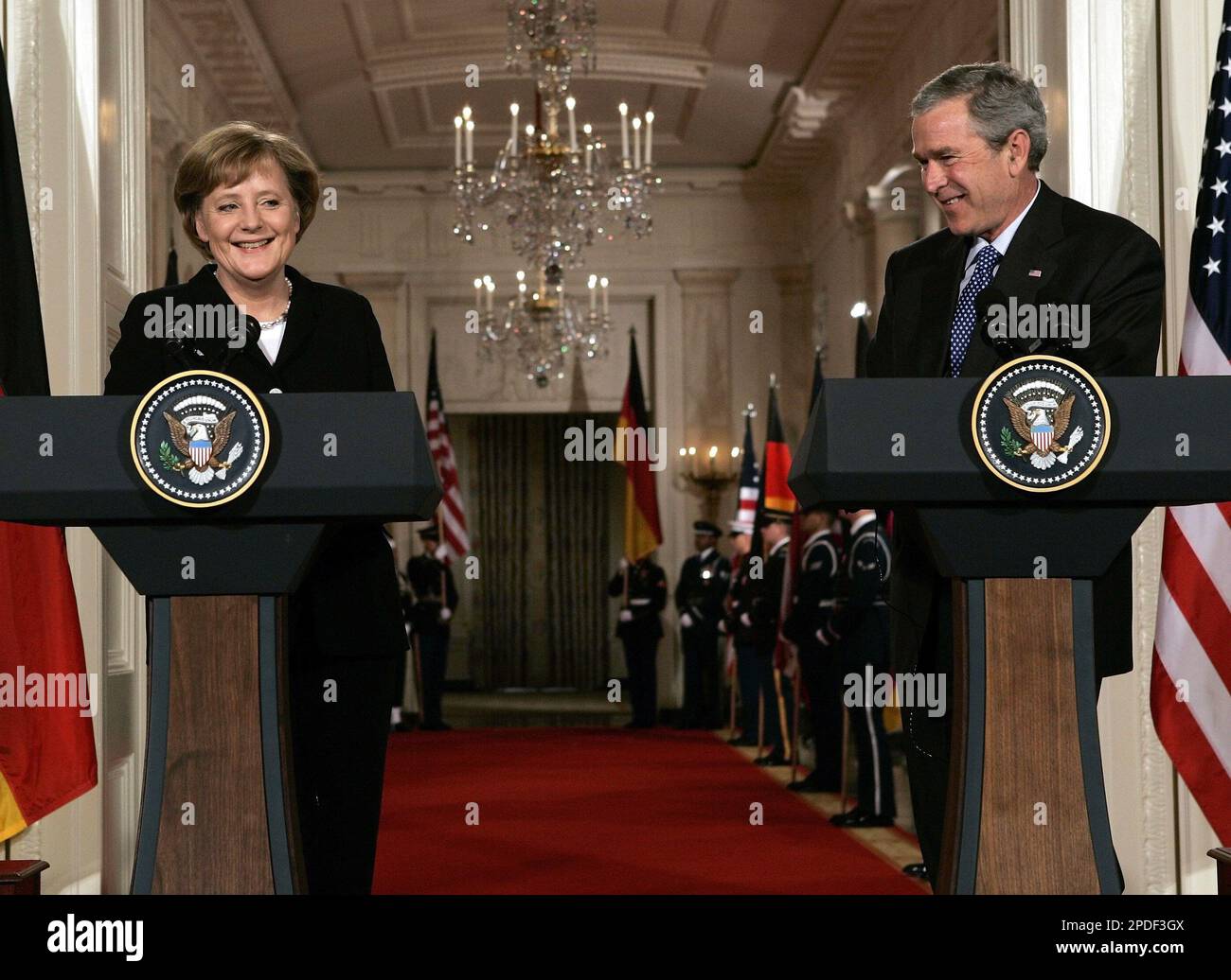 President Bush and German Chancellor Angela Merkel, left, share a laugh ...