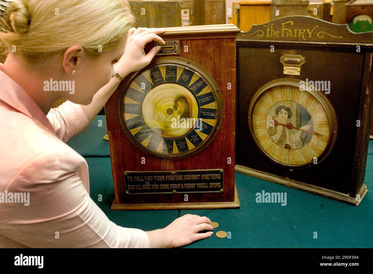 Christie's staff Elena Mason-Brown uses a Gypsy Fortune Teller, left ...