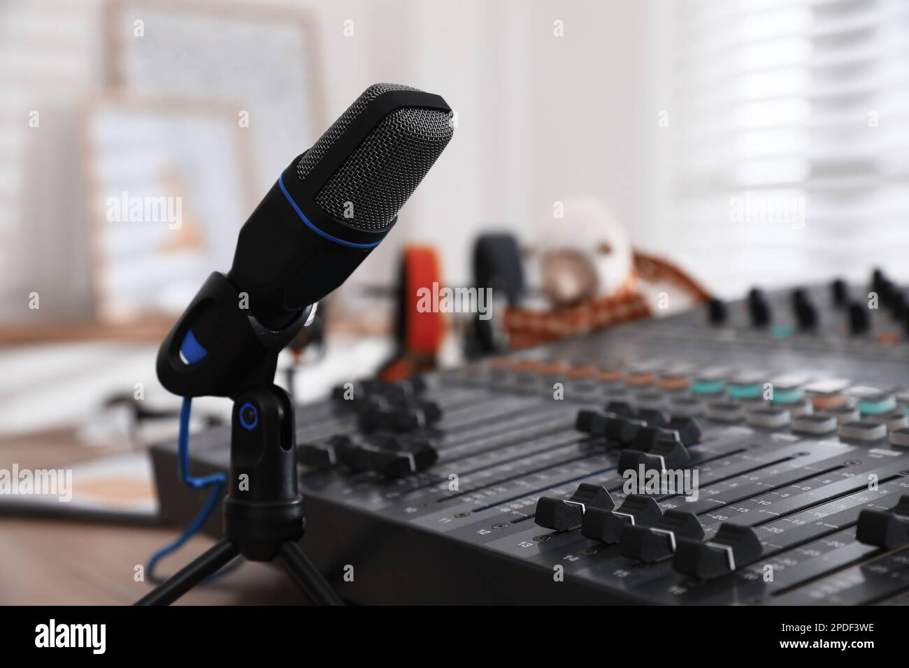 Microphone and professional mixing console in radio studio Stock Photo ...