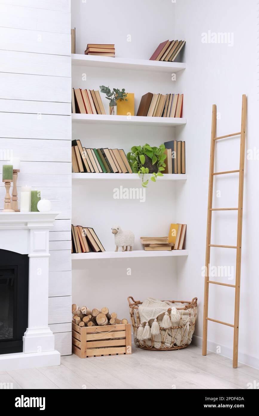 Collection of books and decor elements on shelves indoors. Interior ...