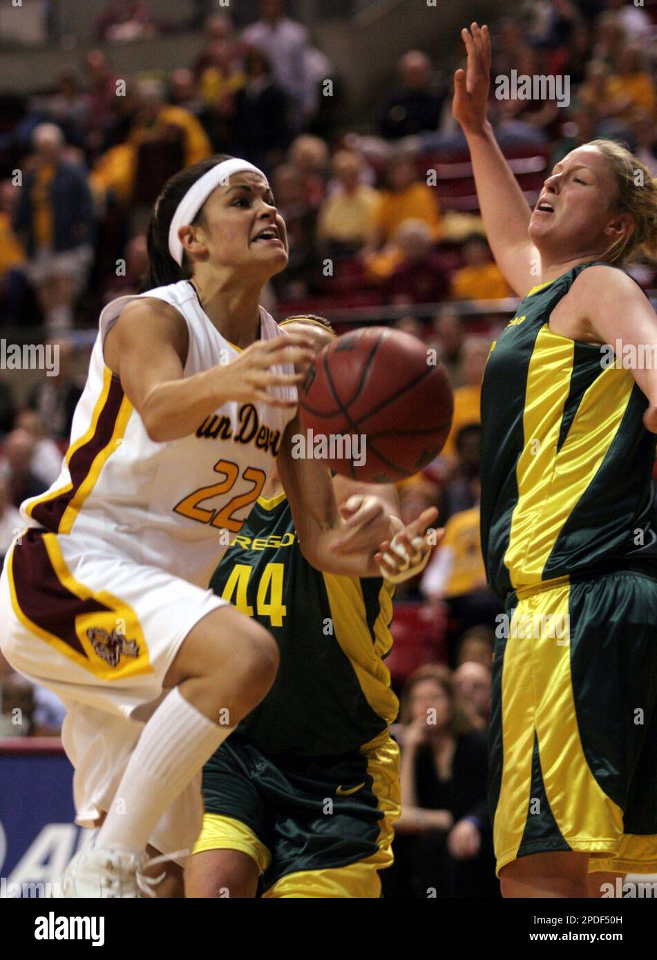 Arizona State's Jill Noe (22) is fouled by Oregon guard Chelsea Wagner ...