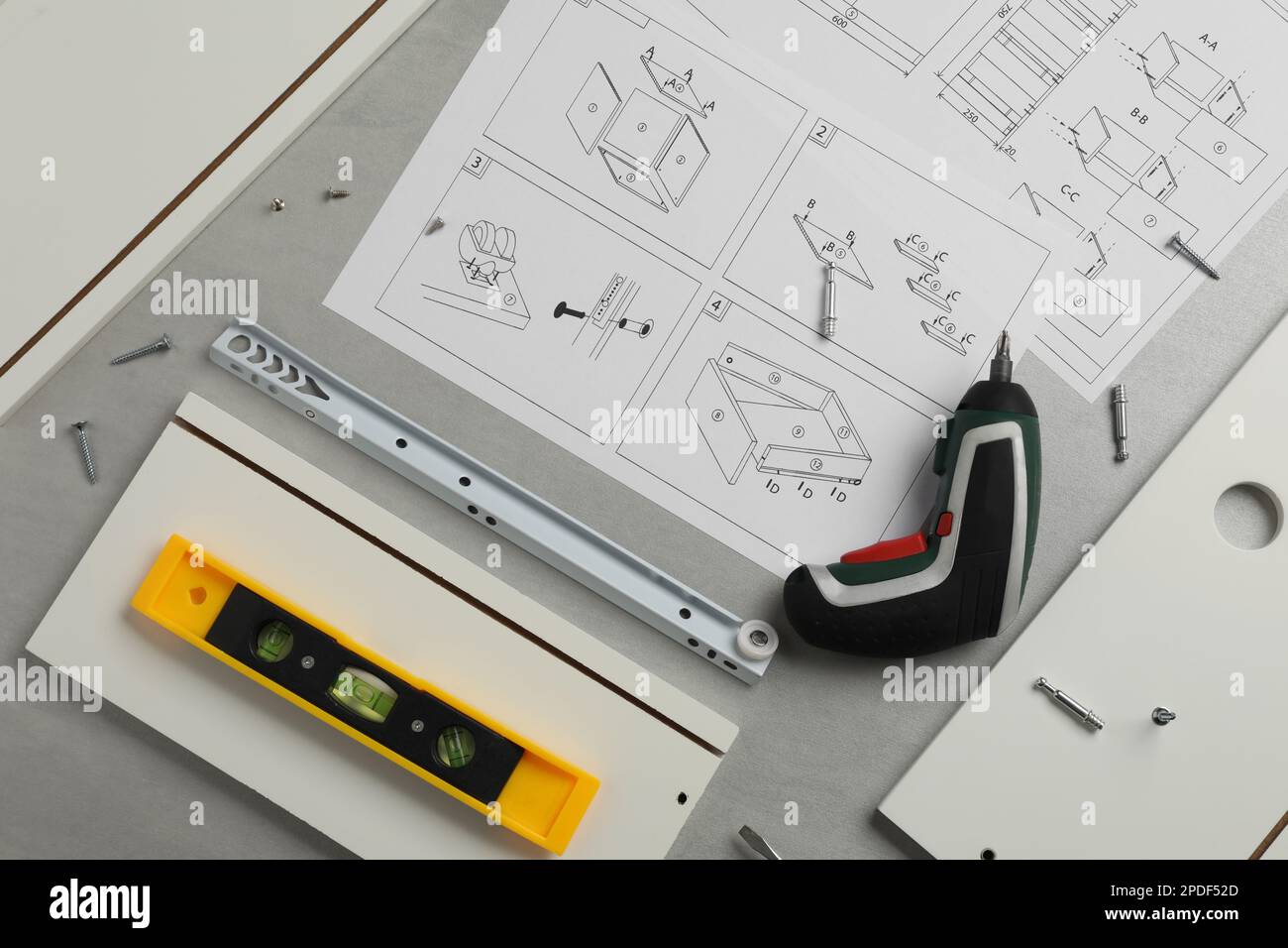 Flat lay composition with furniture parts and tools for self-assembly ...