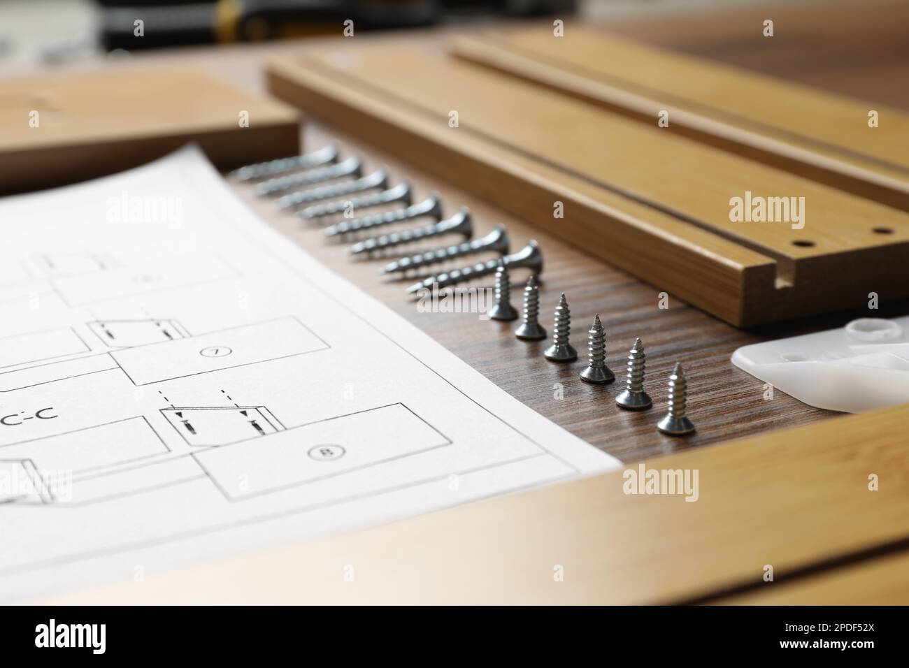 Composition with furniture parts and tools for self-assembly on wooden ...