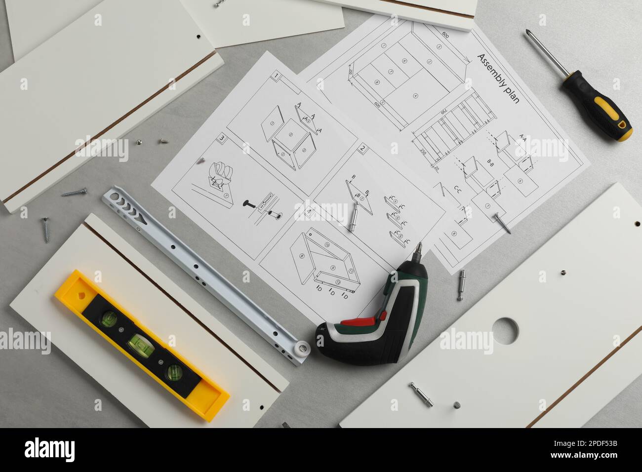 Flat lay composition with furniture parts and tools for self-assembly ...