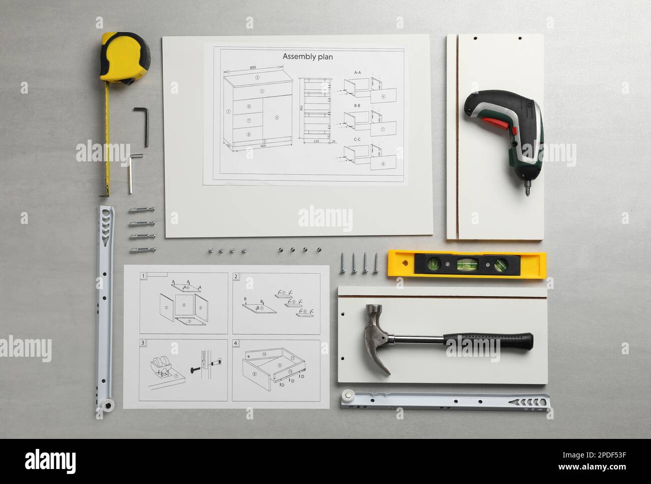 Flat lay composition with furniture parts and tools for self-assembly ...