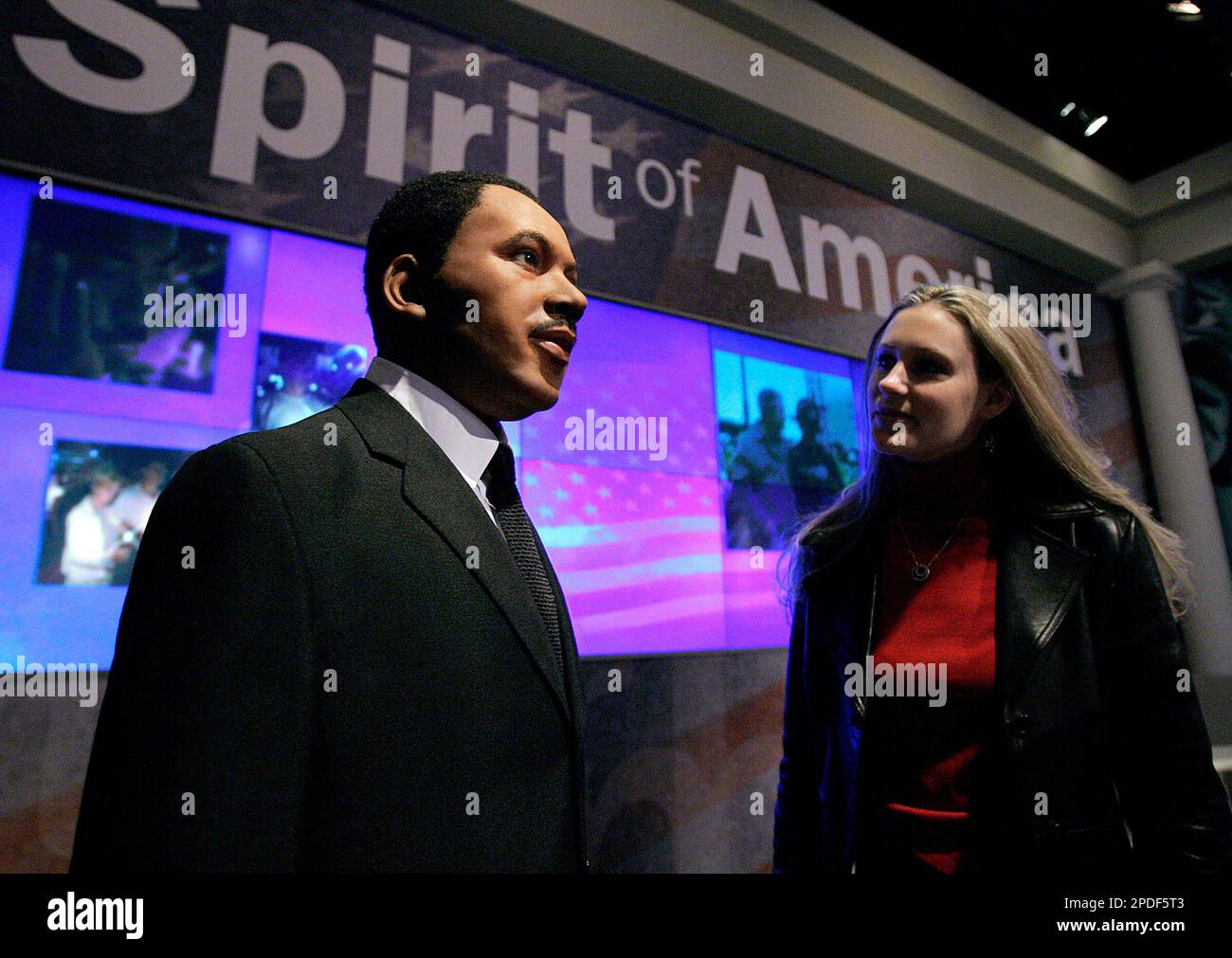 Marissa Burnett, right, of Taylorville, Ill., looks at the wax figure ...