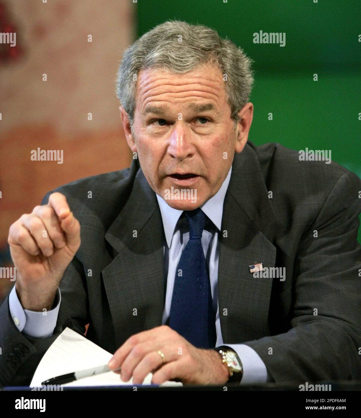 President Bush gestures during a discussion with small business owners ...