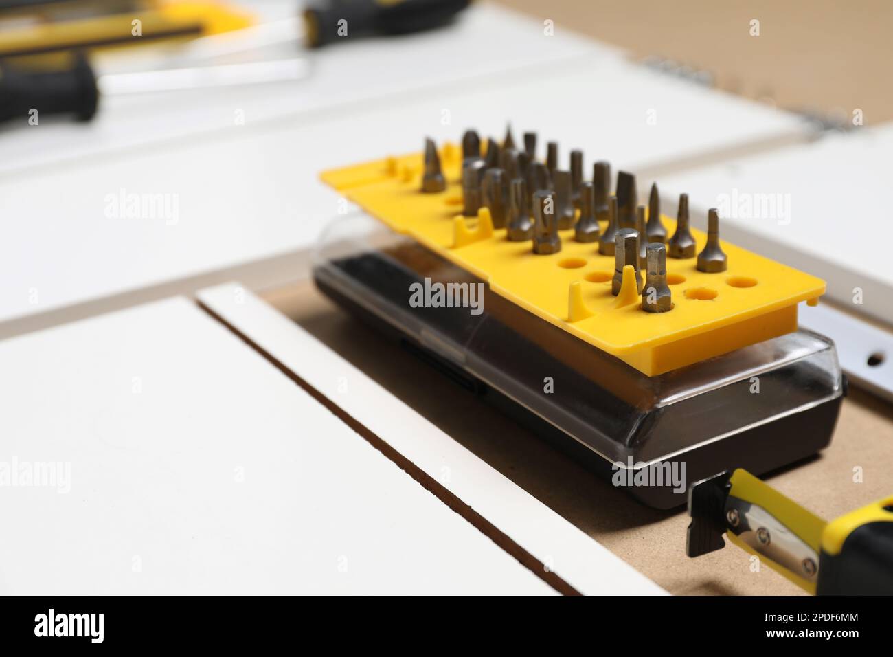 Furniture parts and equipment for self-assembly on brown background ...