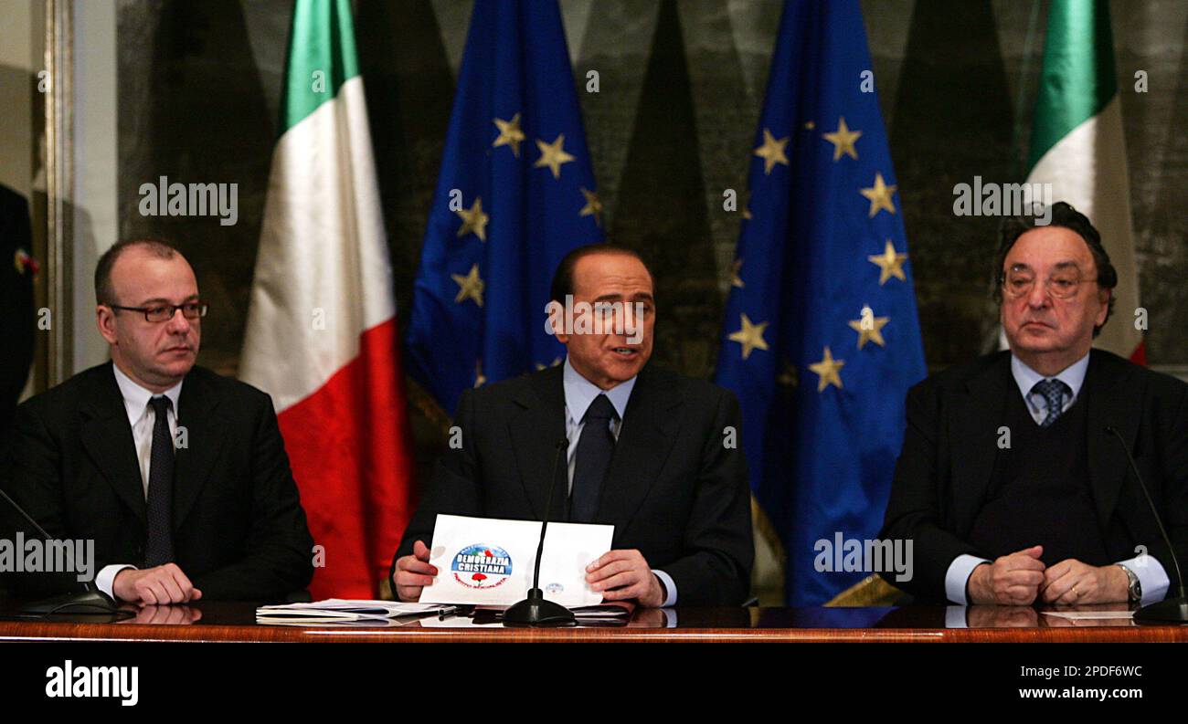Italian Premier Silvio Berlusconi, center, flanked by Christian ...