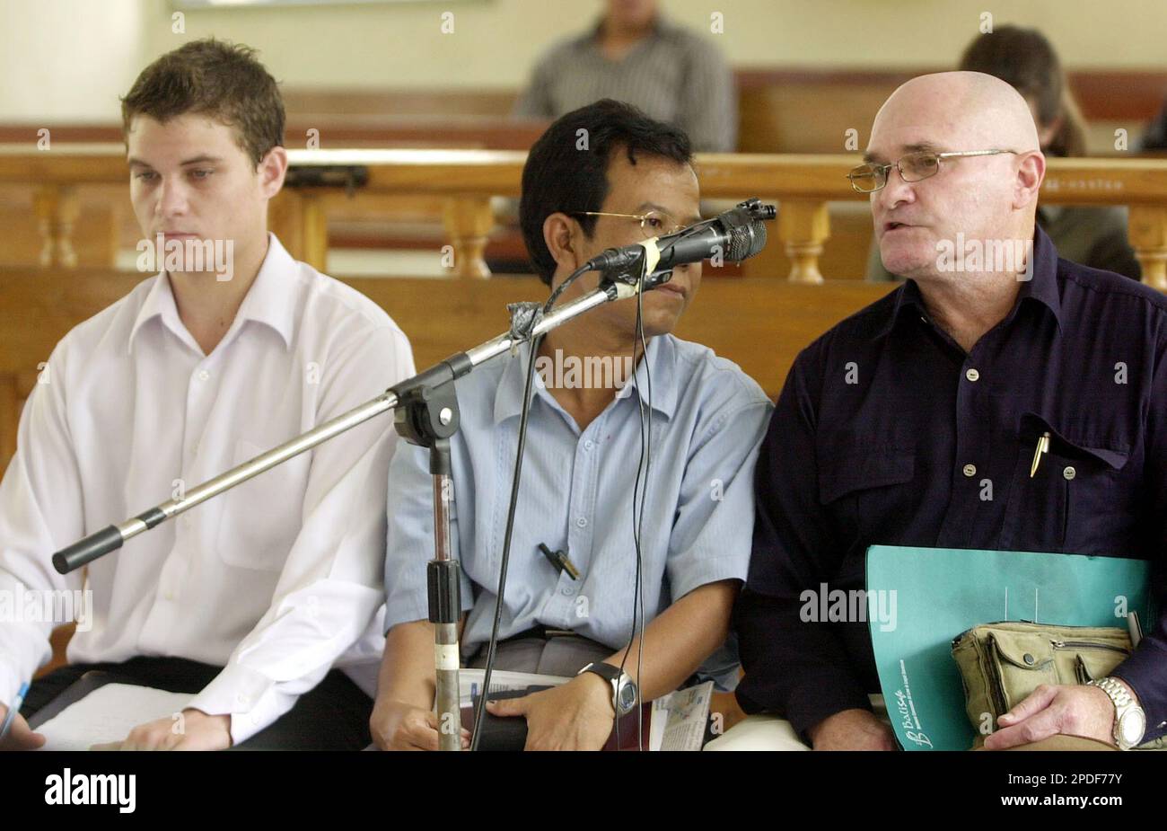 Australian drug suspect Scott Rush, left, listens as his father Lee ...