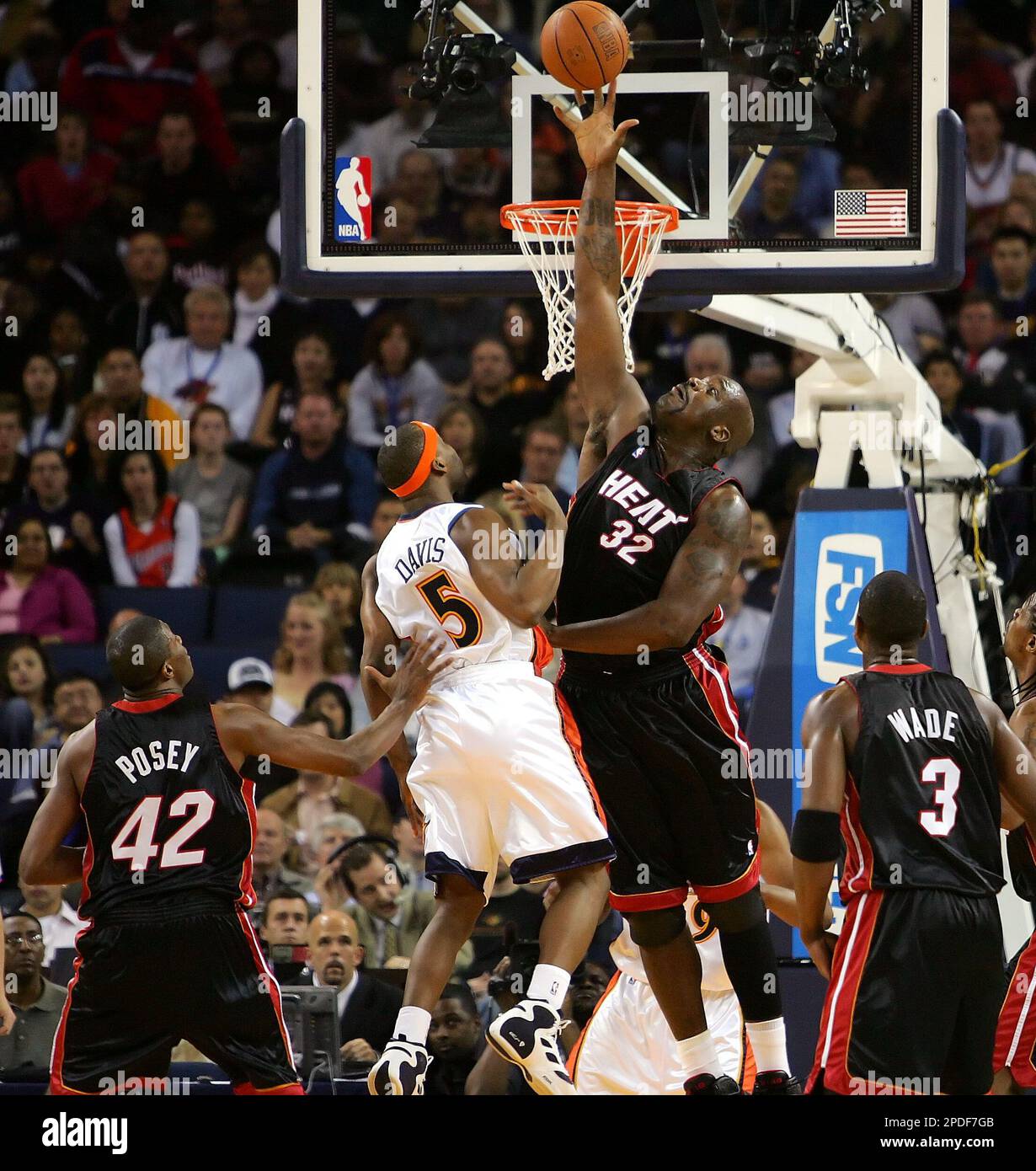 Miami Heat center Shaquille O'Neal (32) blocks a shot attempt by Golden ...