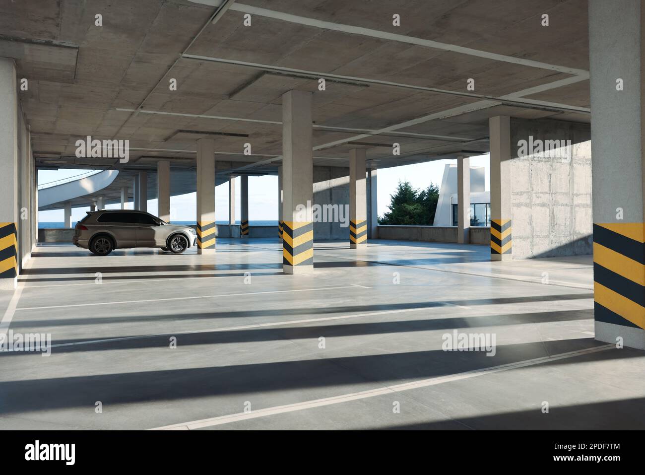 Open parking garage with car on sunny day Stock Photo - Alamy