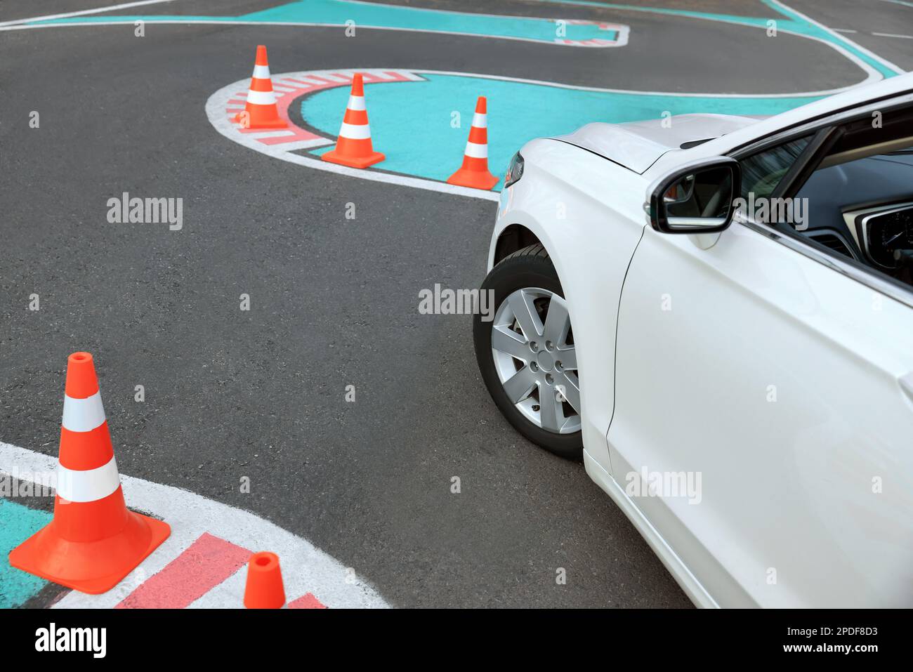 Modern car on test track with traffic cones, above view. Driving school ...
