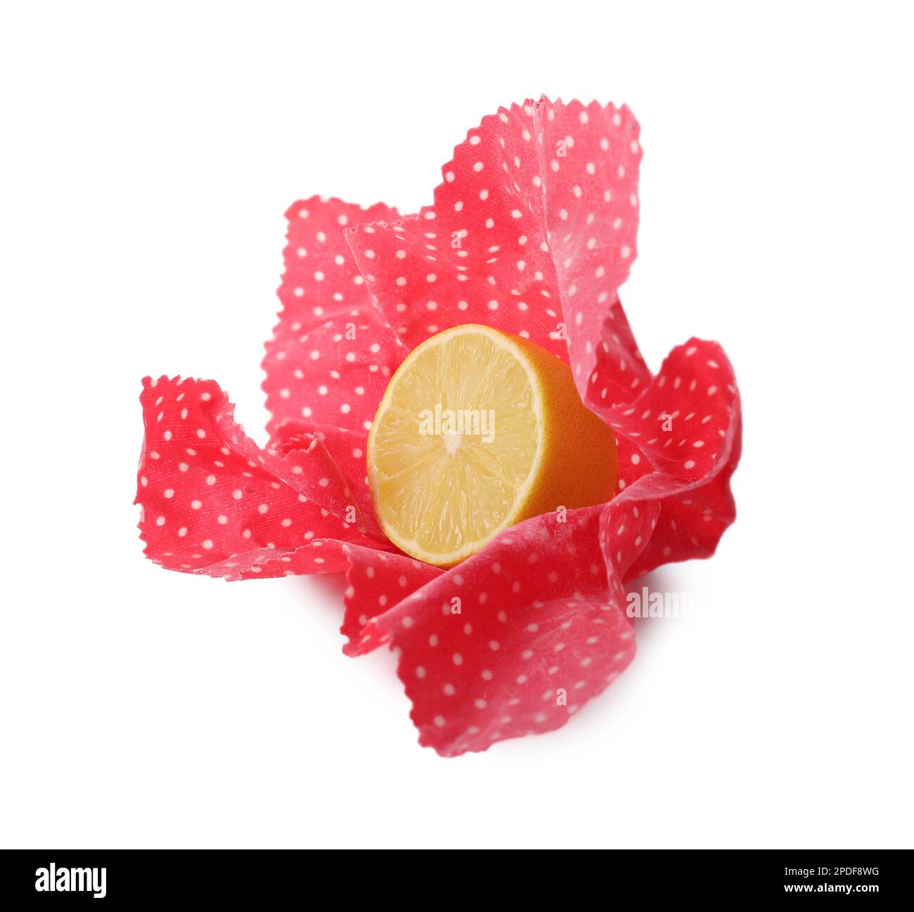 Half of lemon in red beeswax food wrap on white background Stock Photo ...