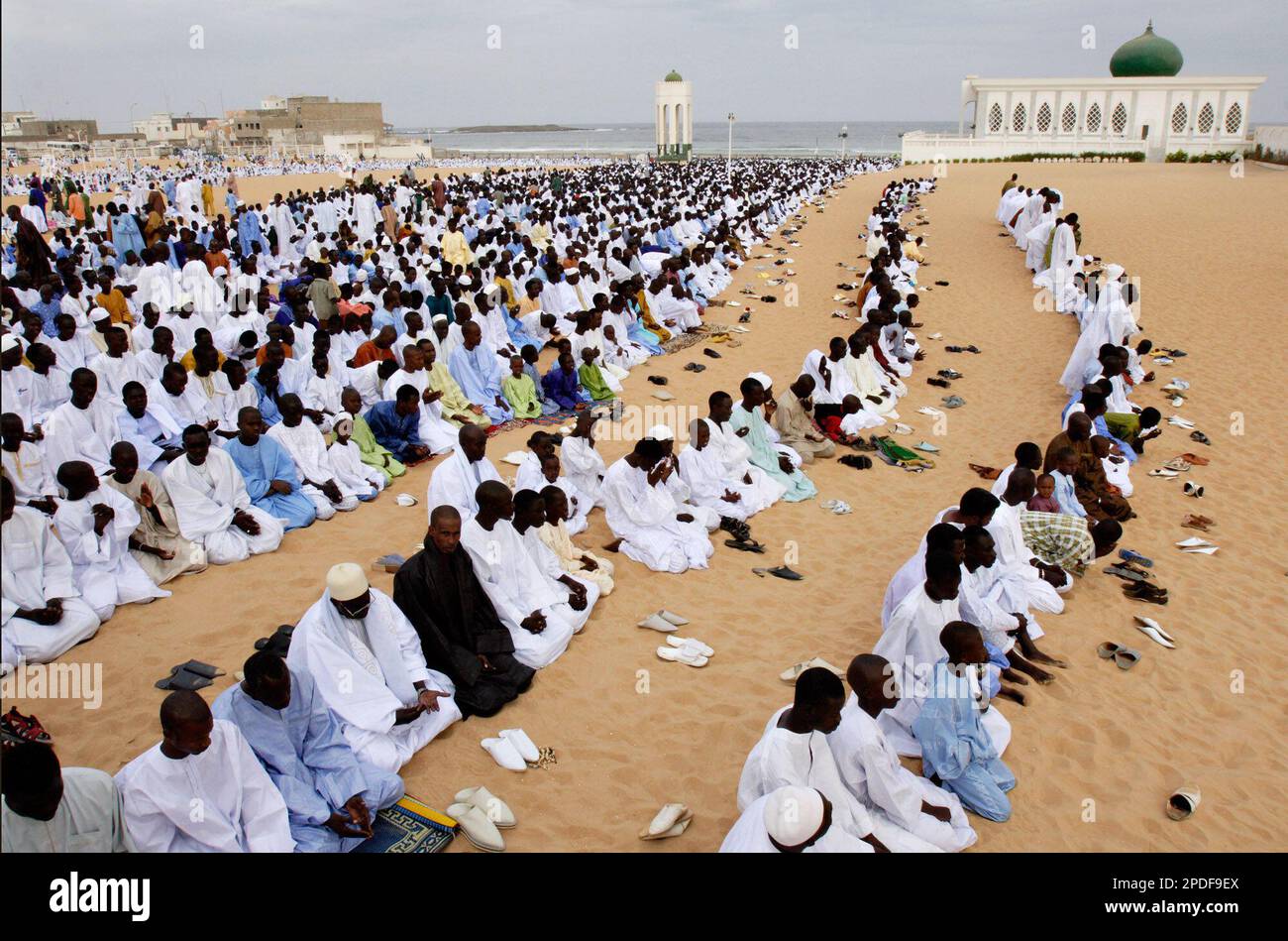 Senegalese Muslims of the Layenne brotherhood pray at the Diamalaye ...