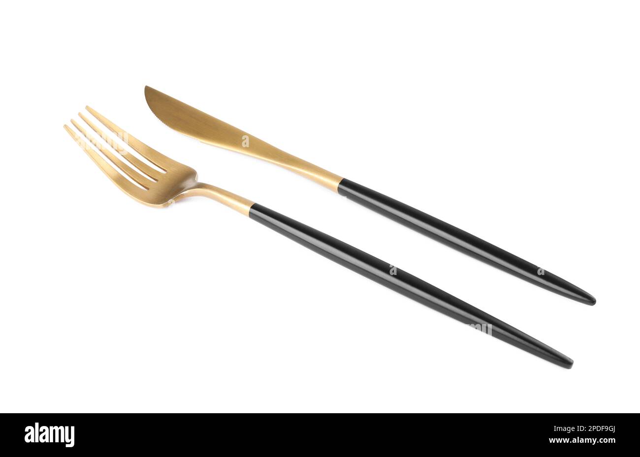New golden fork and knife with black handles on white background Stock ...