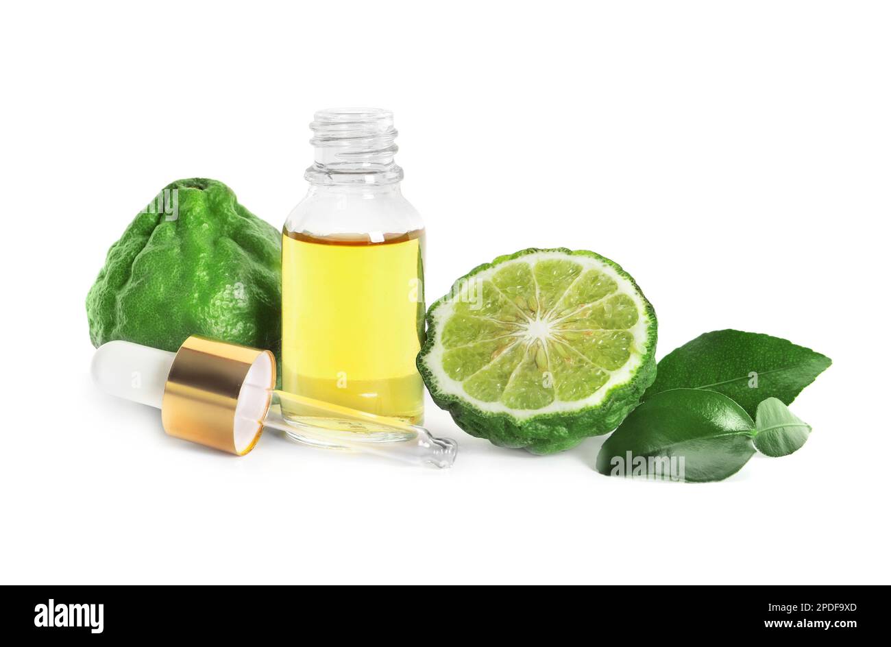Bottle of essential oil, fresh bergamot fruits and leaves on white ...